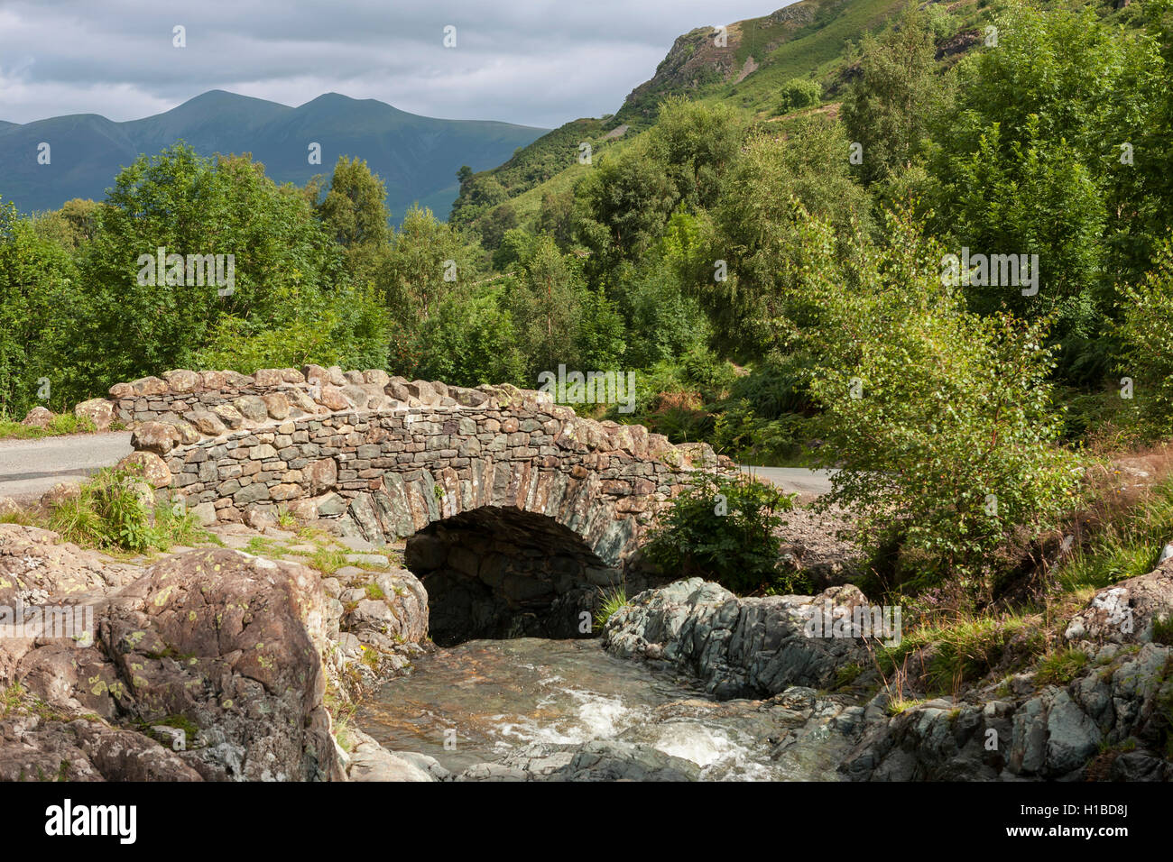 Ashness Bridge over Barrow Beck, Borrowdale, with Skiddaw in the ...