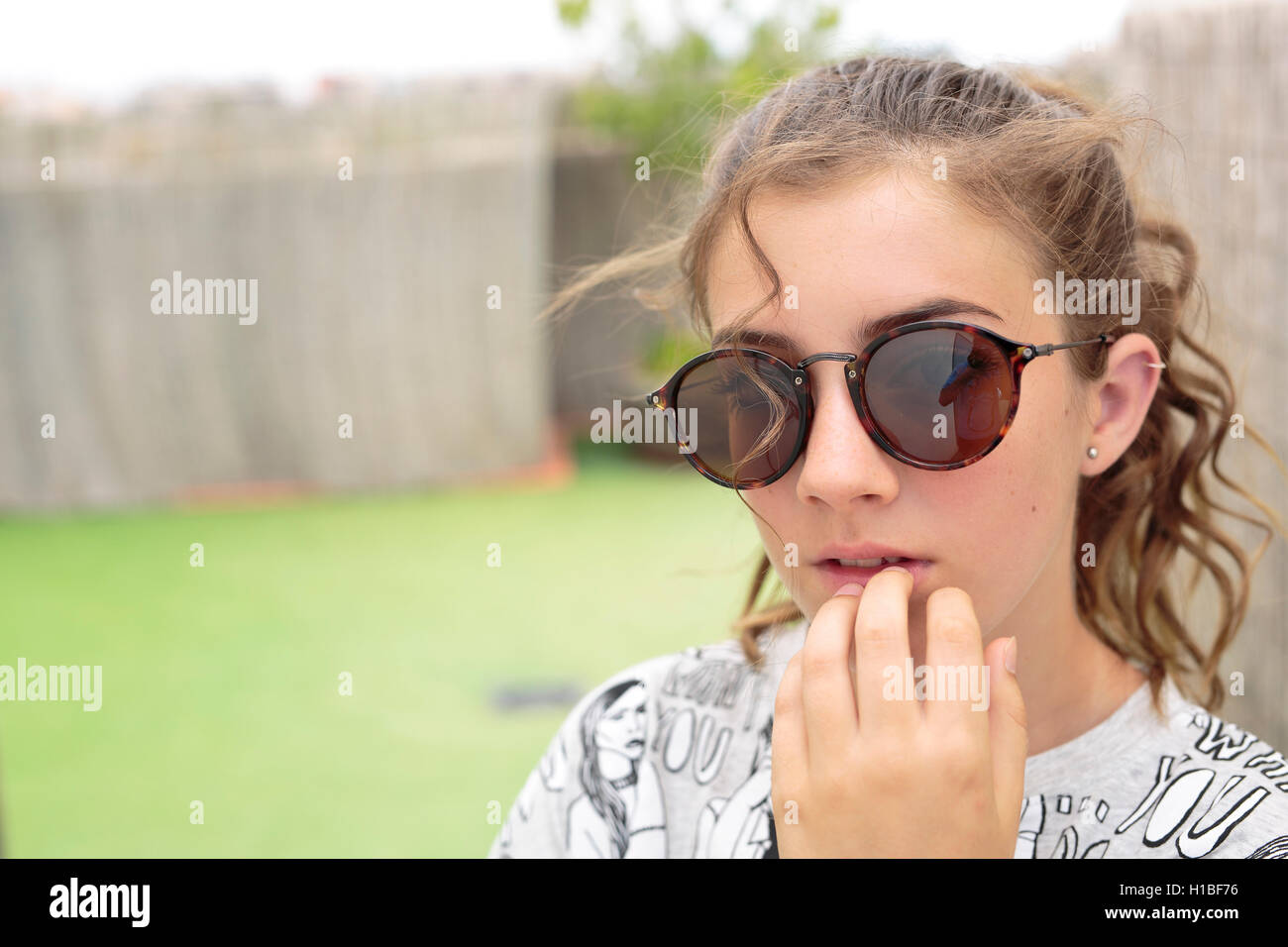 Portrait of young girl with sunglasses and unfocused background Stock ...