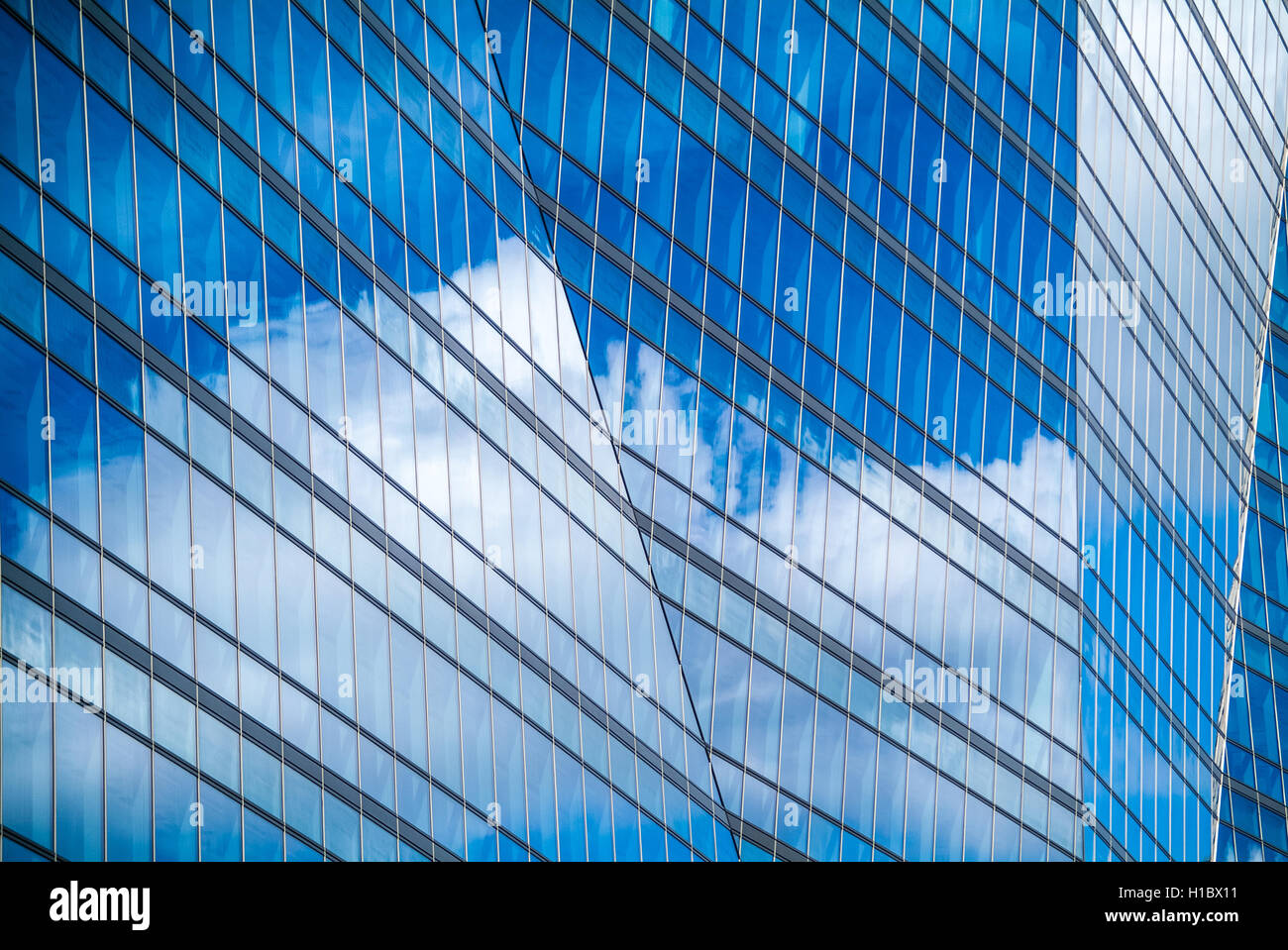 abstract photo of a modern glass building reflecting the sky Stock ...