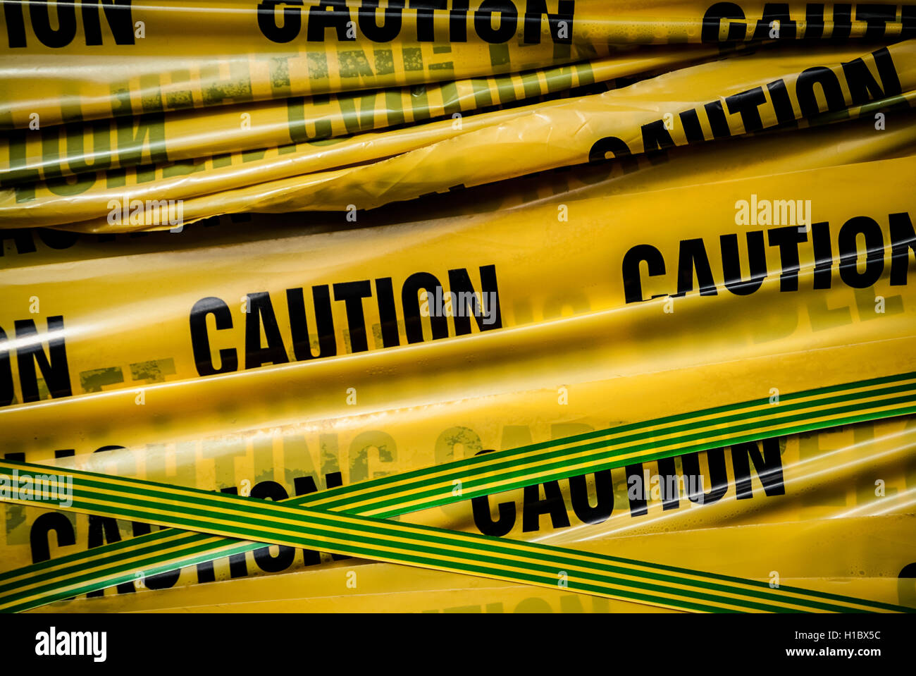 abstract close-up photo of yellow "caution" tape Stock Photo - Alamy