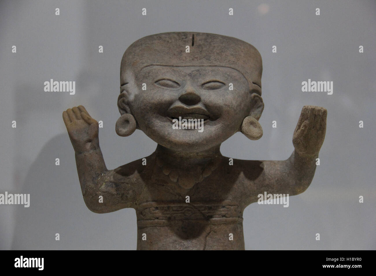 Statues with representations of smiling faces on display at the ...