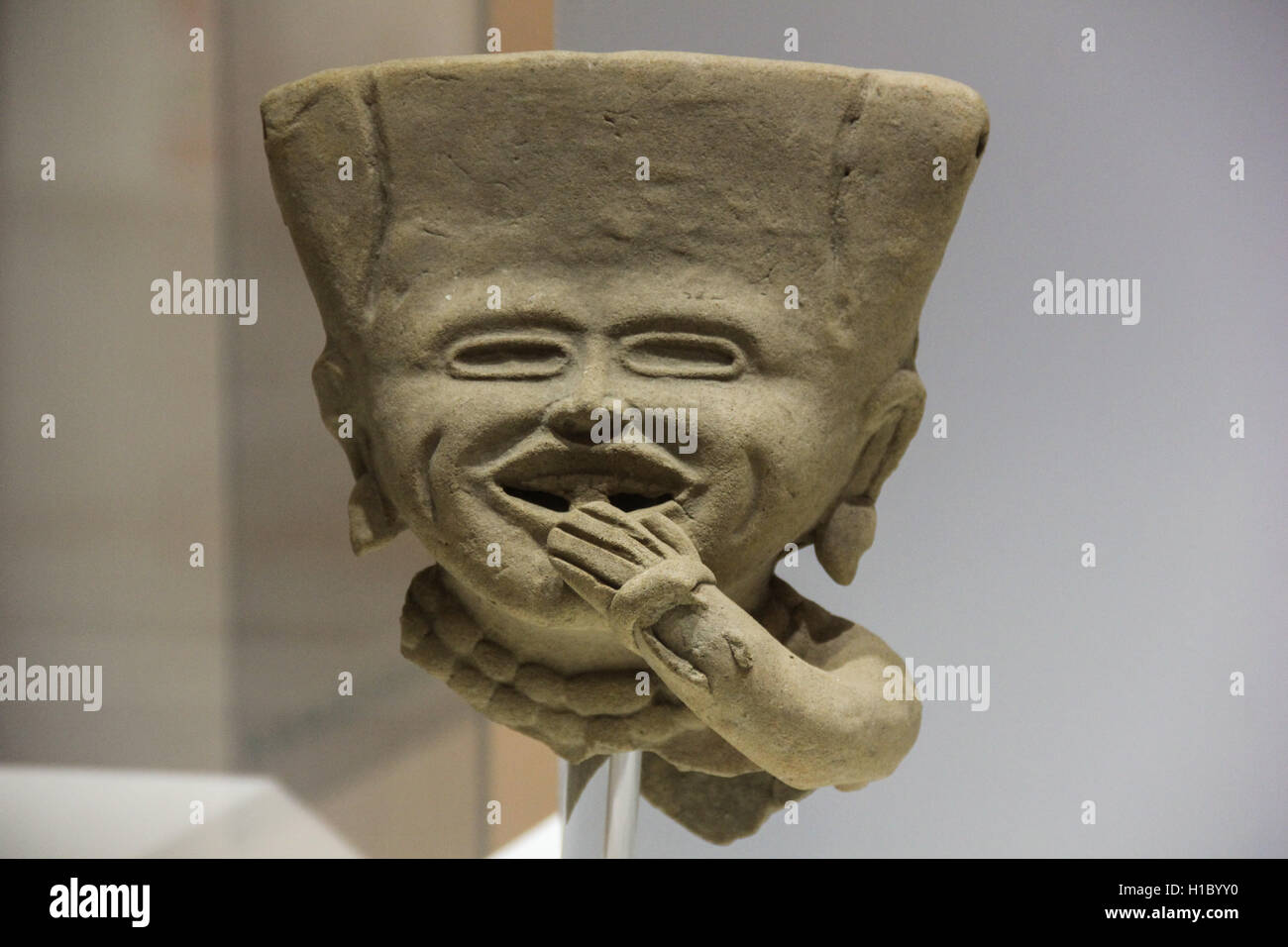 Statues with representations of smiling faces on display at the ...