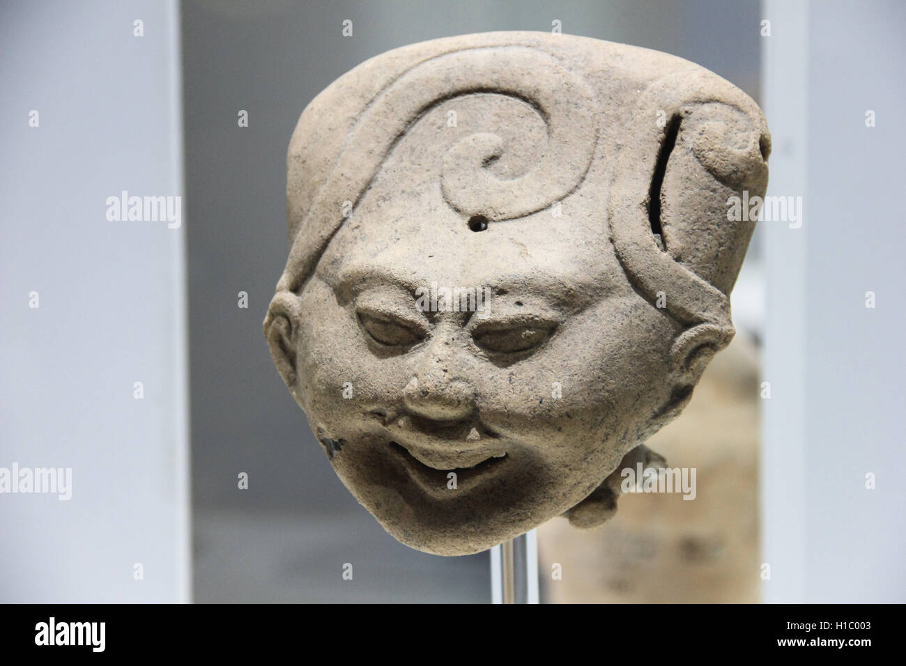 Statues with representations of smiling faces on display at the ...