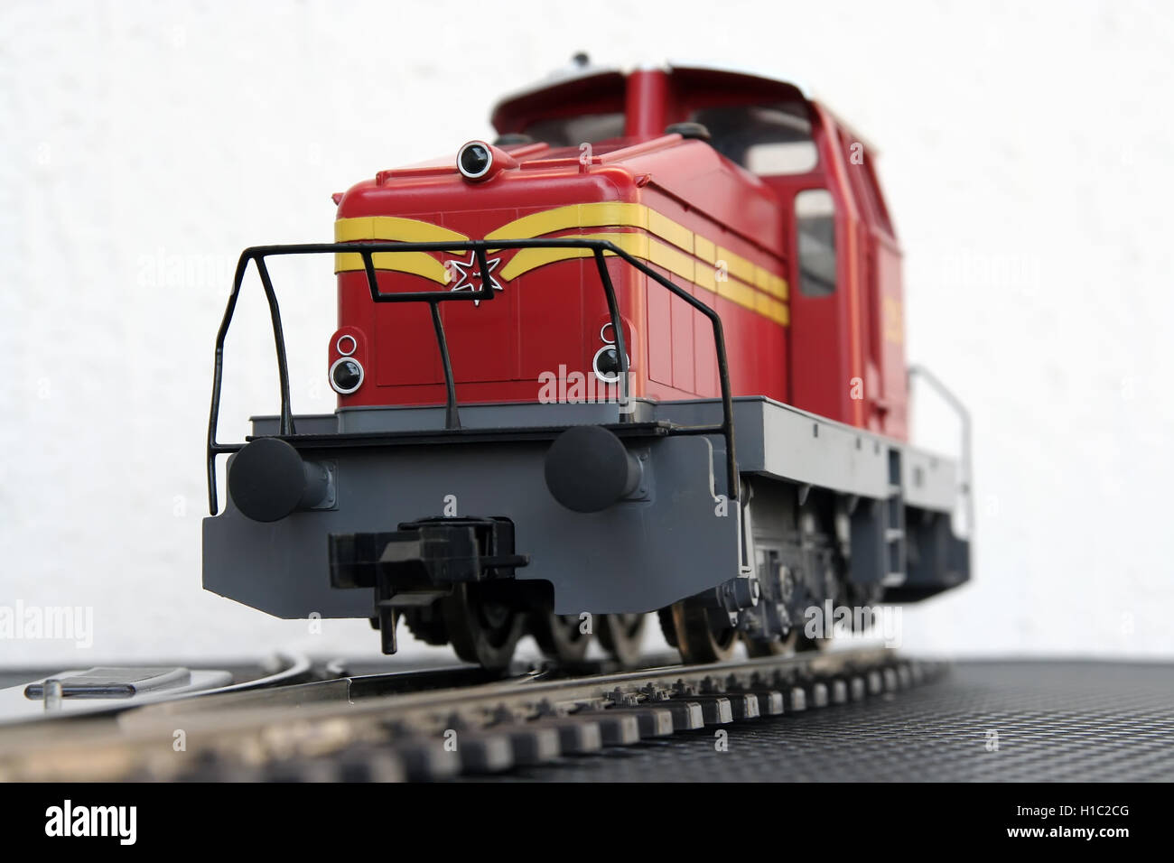 Red Locomotive miniature model. Red locomotive toy model Stock Photo ...