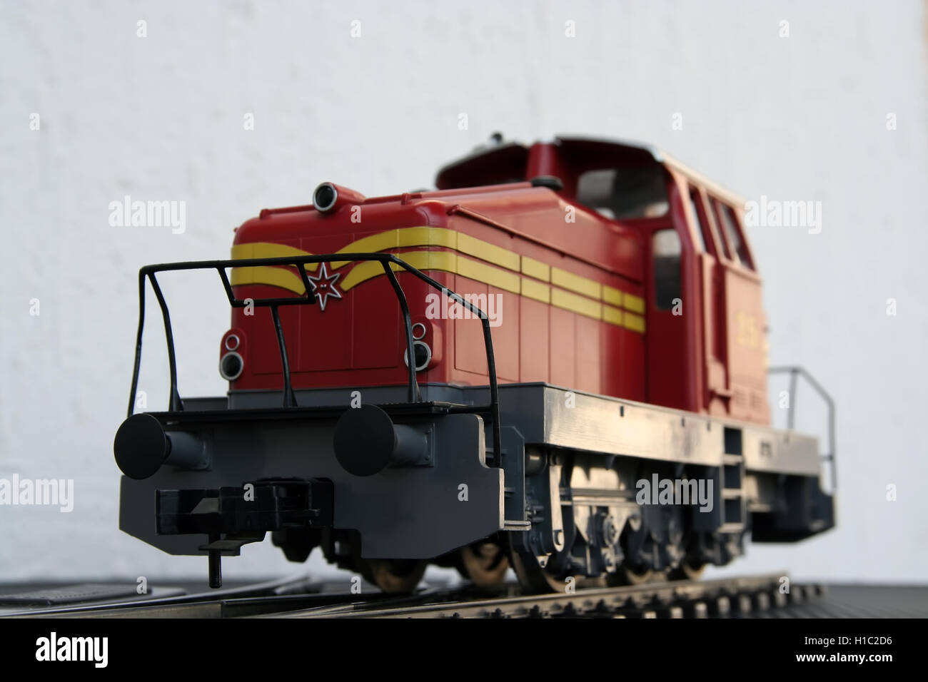 Red Locomotive miniature model. Red locomotive toy model Stock Photo ...