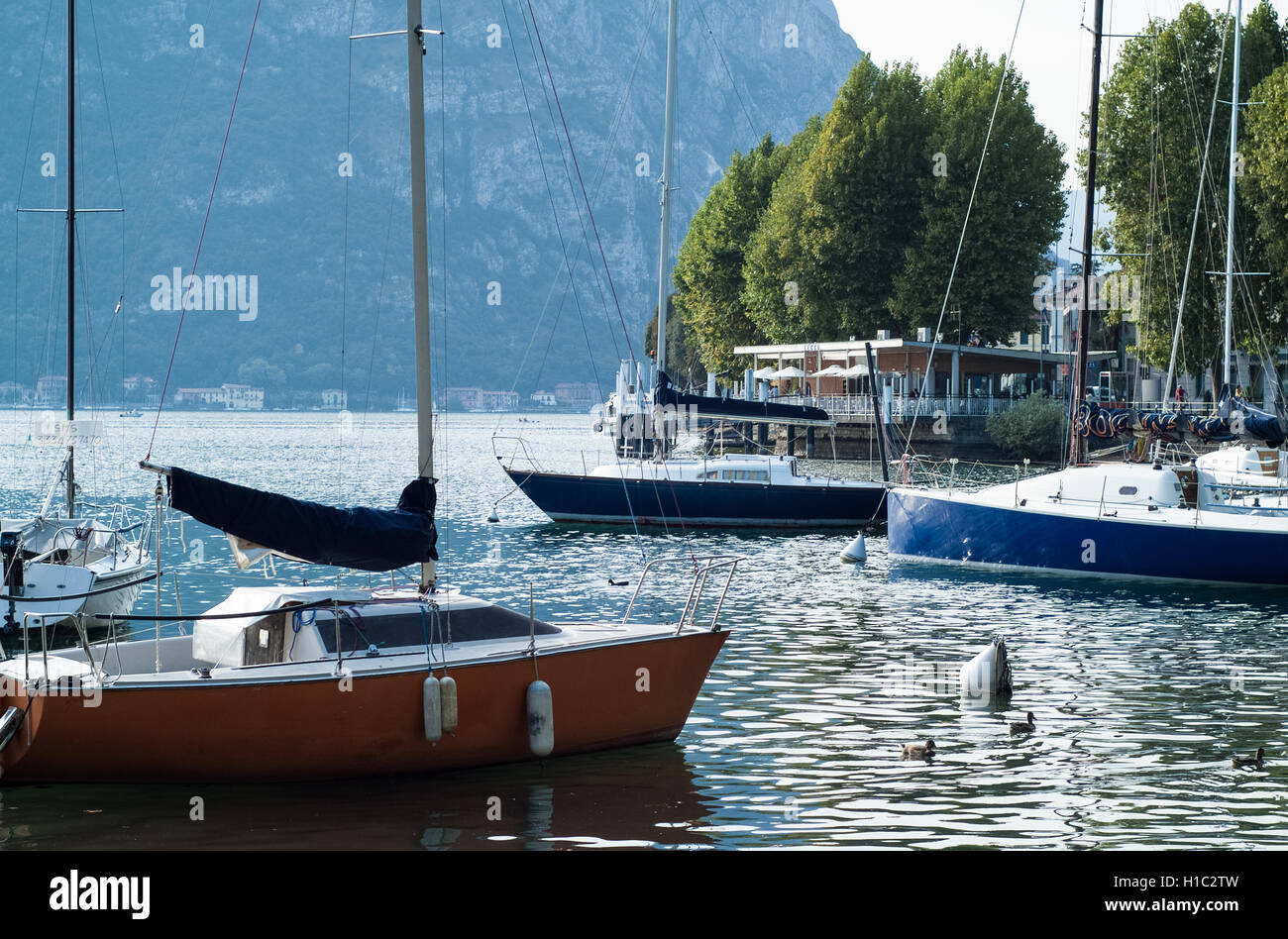 boats floating on the glittery waters of Lake Como in Italy Stock Photo ...