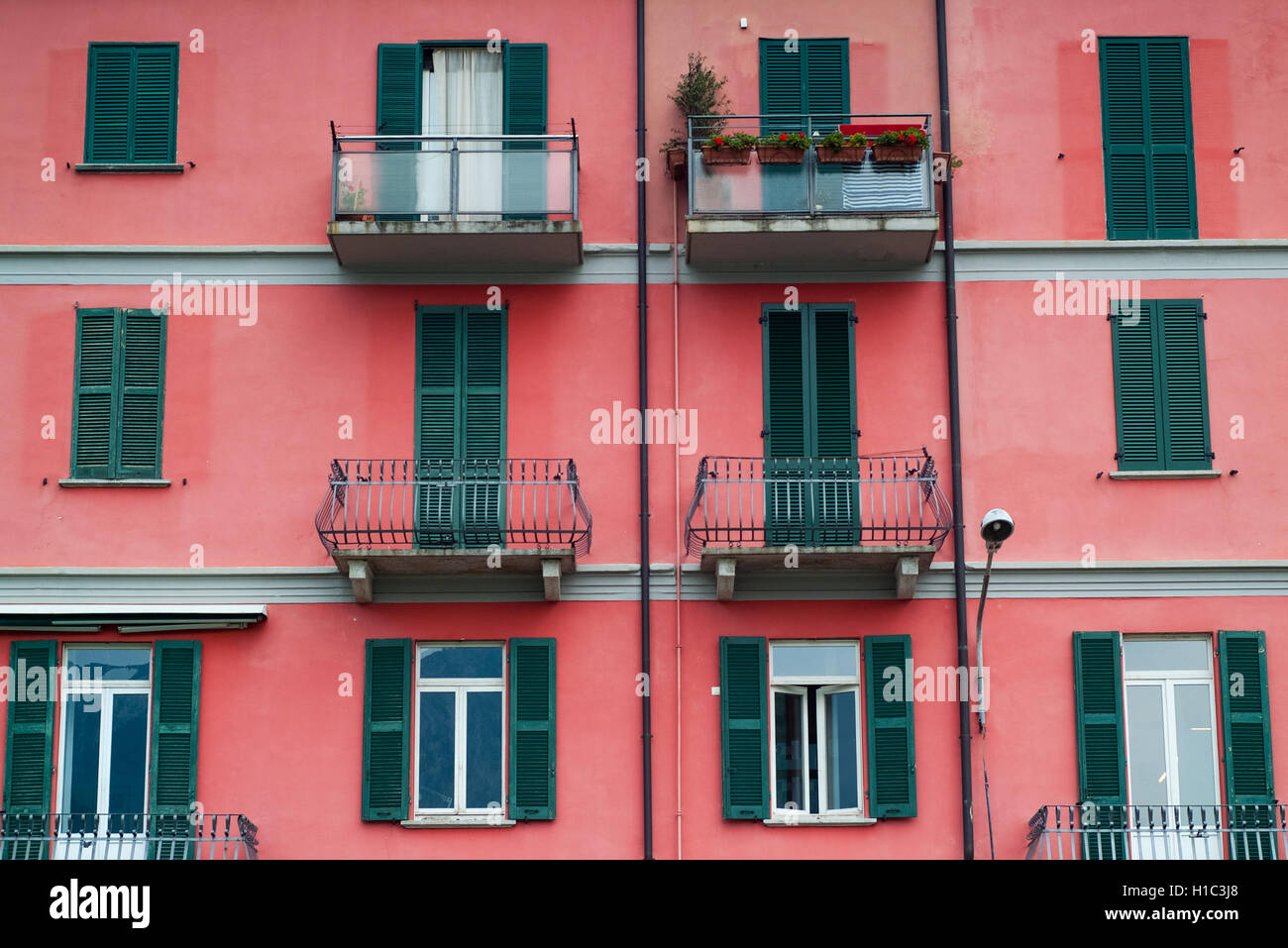 photo of a bright red facade in an Italian town Stock Photo - Alamy