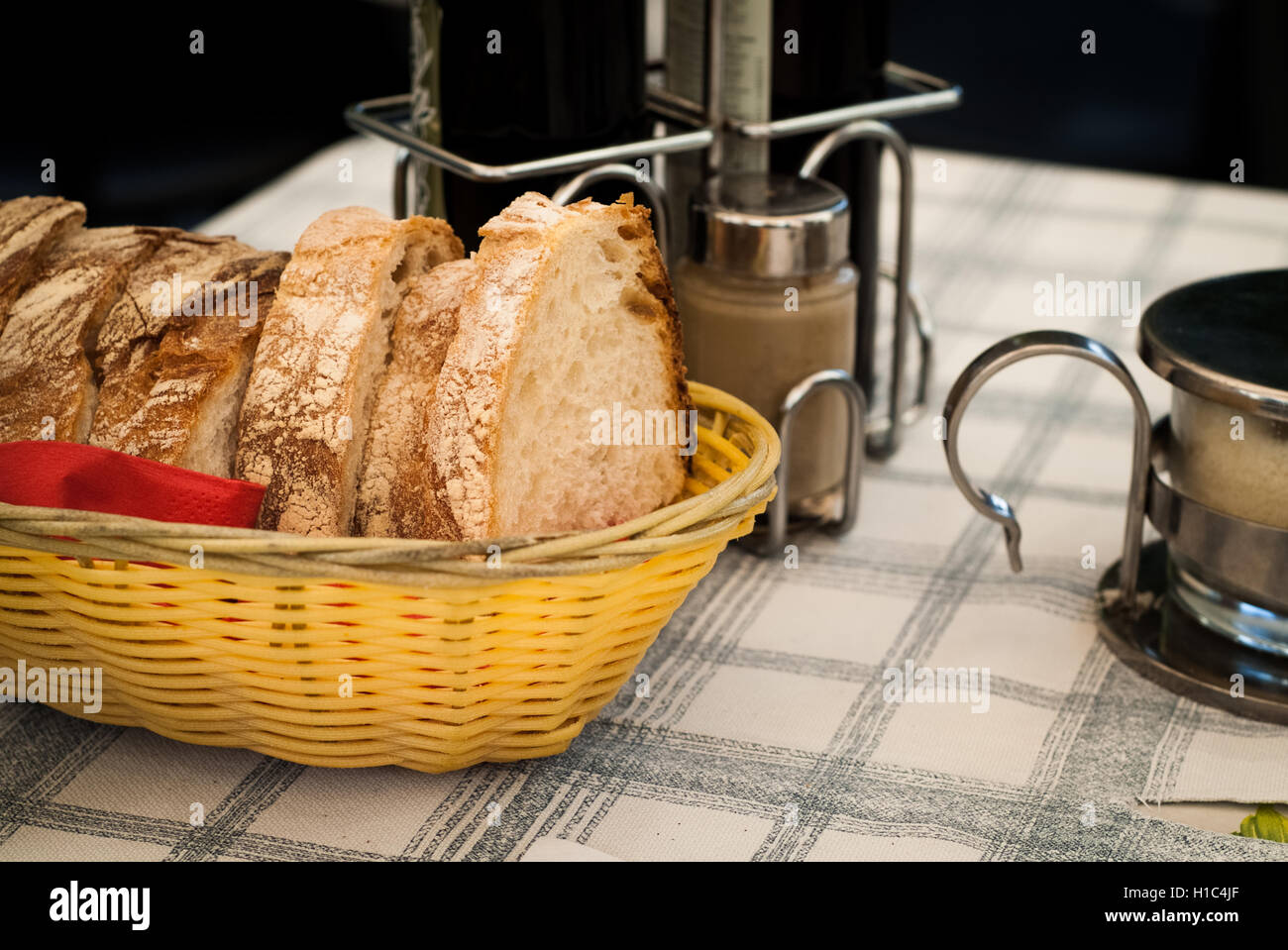 yellow basket full of bread photographed in a small Italian restaurant ...