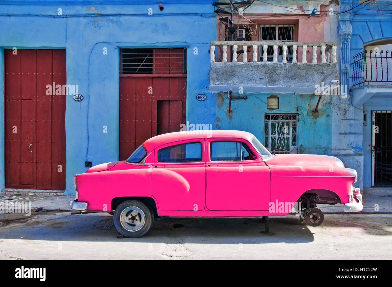 Vintage american car parked in shabby Old Havana street Stock Photo - Alamy