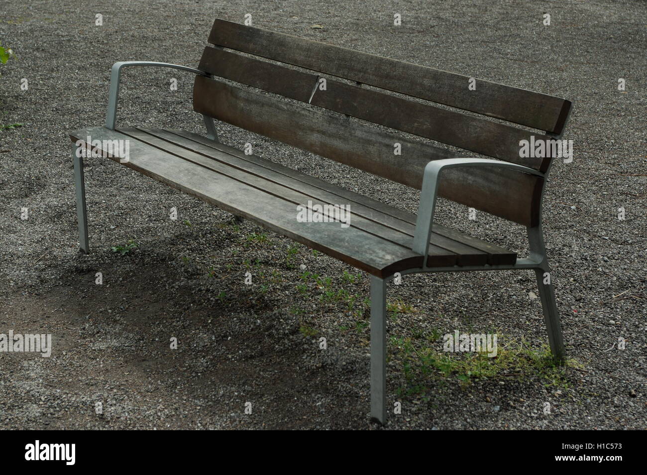 Lonely wooden bench in the park Stock Photo - Alamy