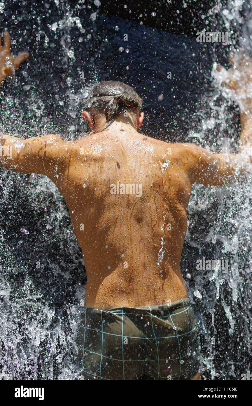 Man bathing under waterfall hi-res stock photography and images - Alamy