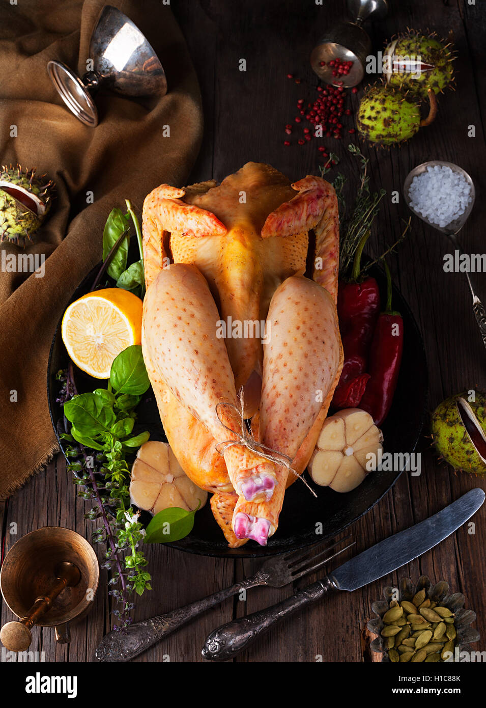 Raw chicken farm with the ingredients in a rustic country style Stock ...