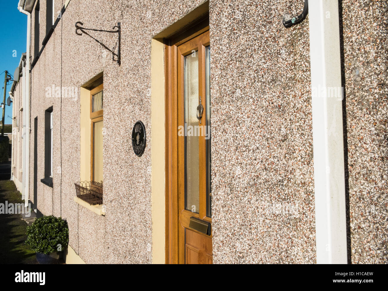 Pebble dashed walls of terraced houses,cottages in centre of hilltop ...