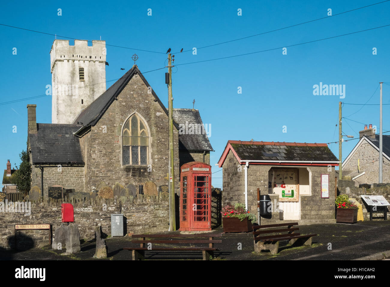 Ancient church and bell tower in centre of village of Llansaint,a ...