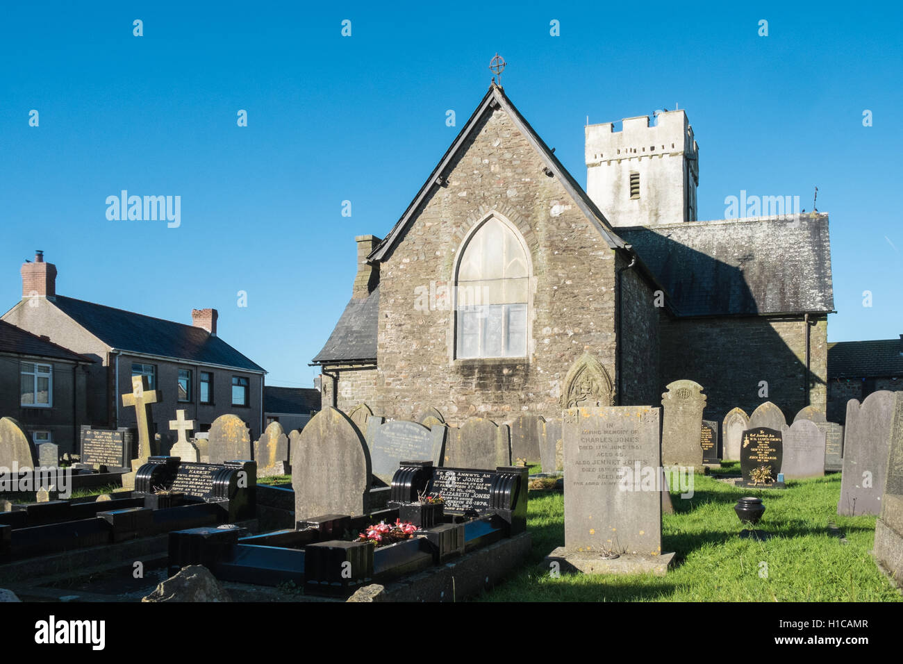 Ancient church and bell tower in centre of village of Llansaint,a ...