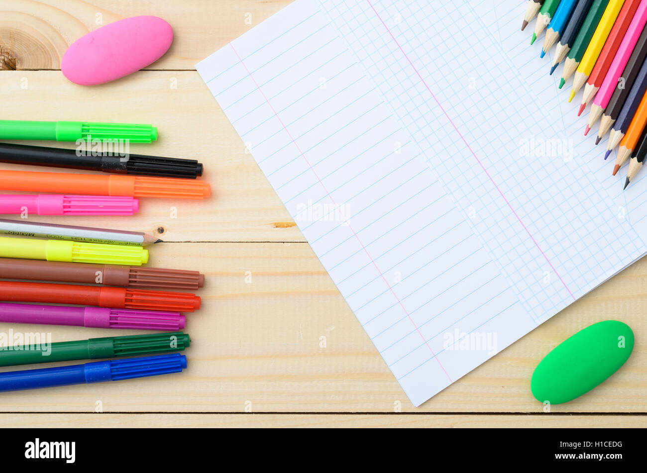 Colored pencils and paper Stock Photo - Alamy