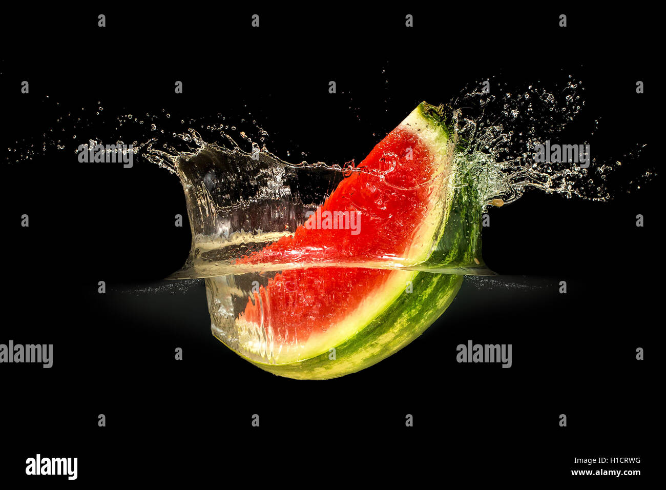 Fresh melon falling in water with splash on black background Stock ...