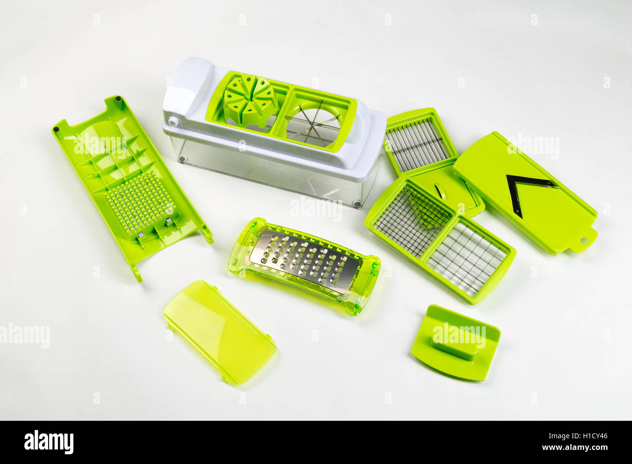 Green Plastic range of vegetable slicers on a light background Stock ...