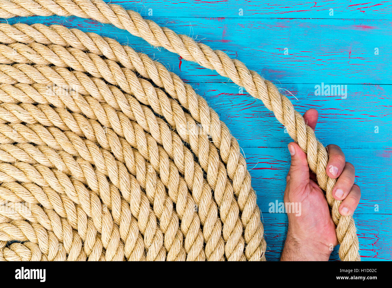 Male hand pulling rope hi-res stock photography and images - Alamy