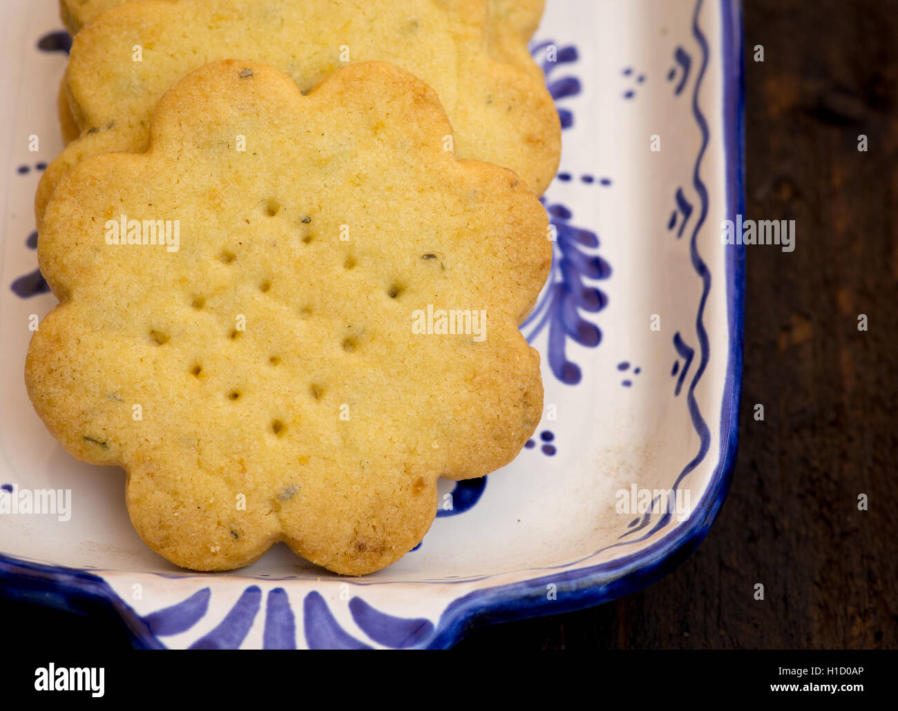 Lemon thyme flower shaped shortbread cookies on blue and white vintage ...