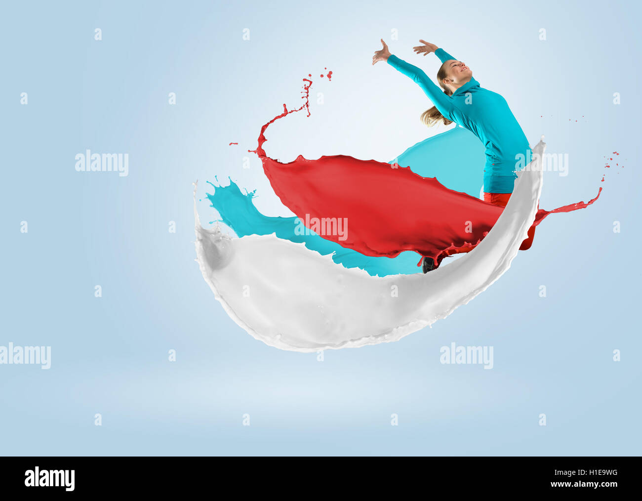 young female dancer jumping with splash of paint Stock Photo - Alamy