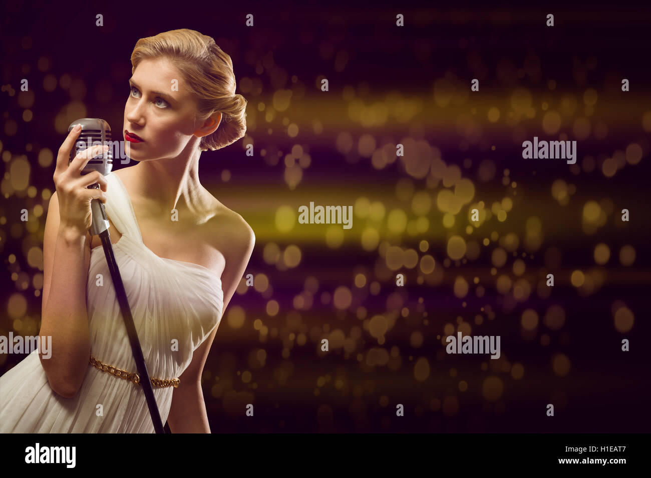 attractive female singer with microphone Stock Photo - Alamy