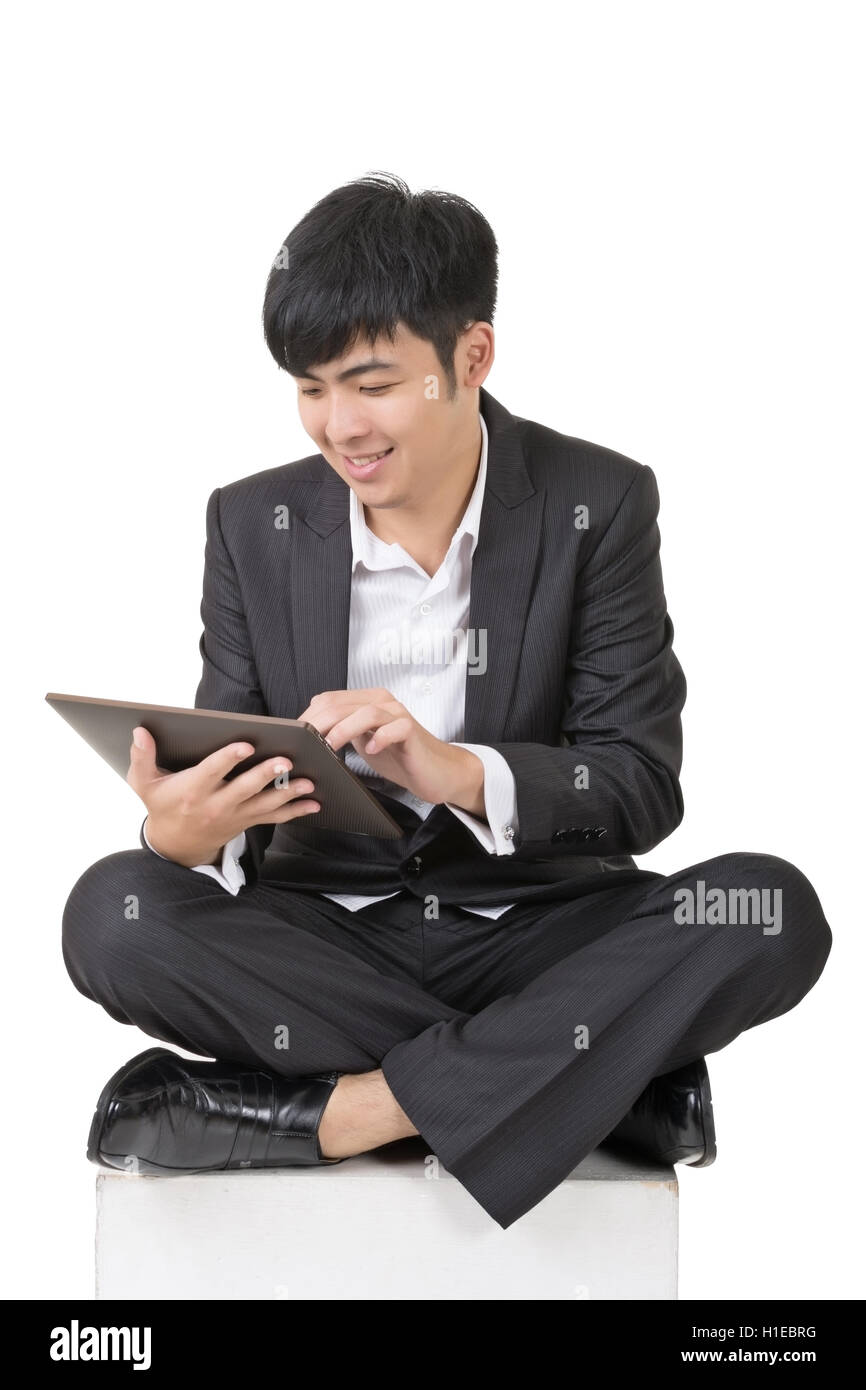Asian businessman use pad Stock Photo - Alamy