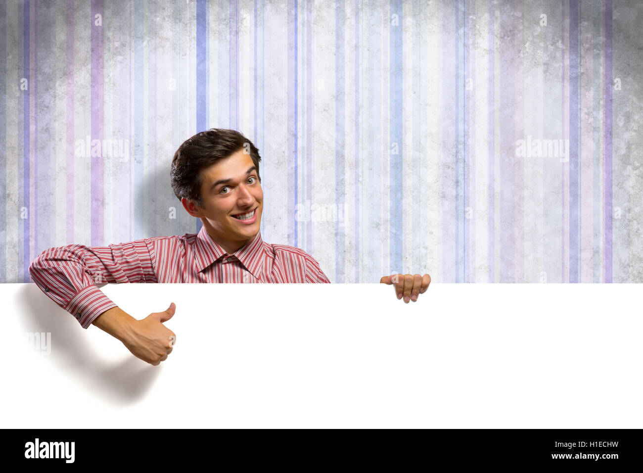 man holding a banner Stock Photo - Alamy