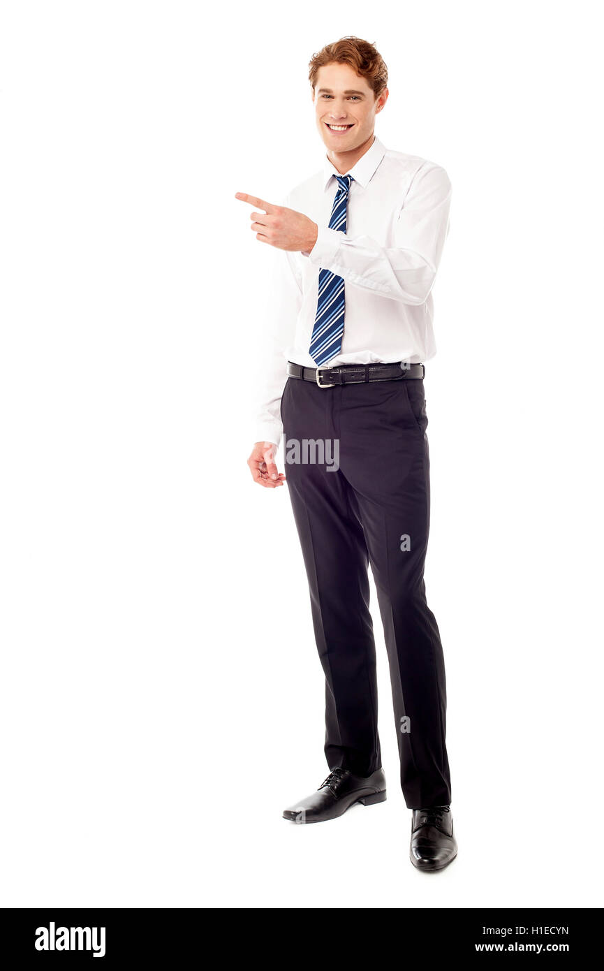 Happy young businessman pointing finger Cut Out Stock Images & Pictures ...