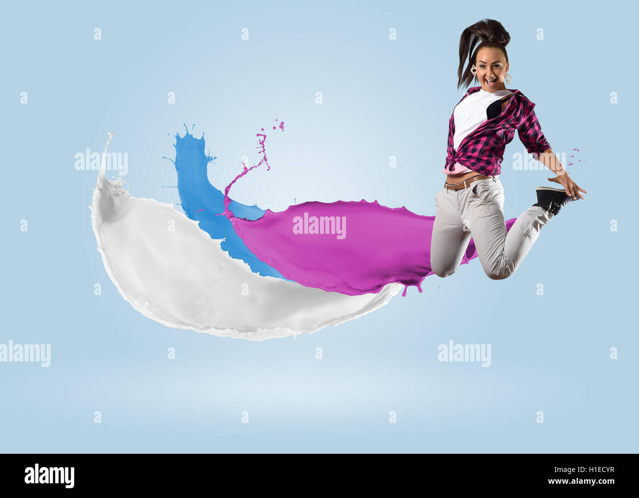 young female dancer jumping with splash of paint Stock Photo - Alamy