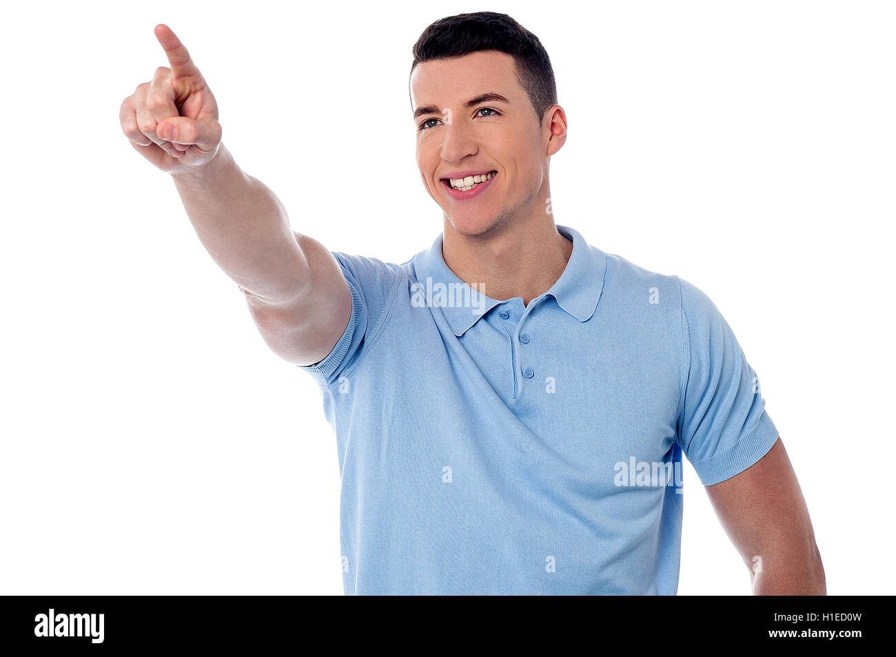 Cheerful man pointing finger showing hi-res stock photography and ...