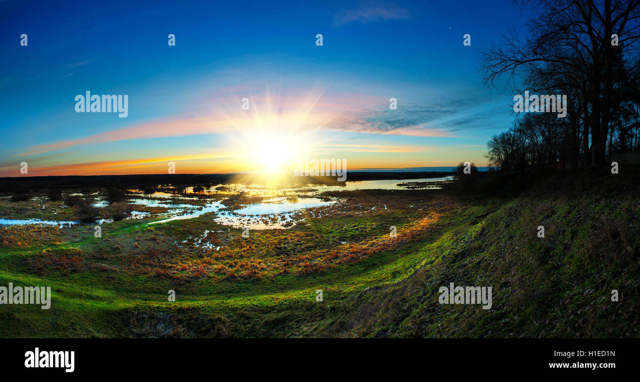 panoramic sunrise over the riverside with bright colors go very Stock ...