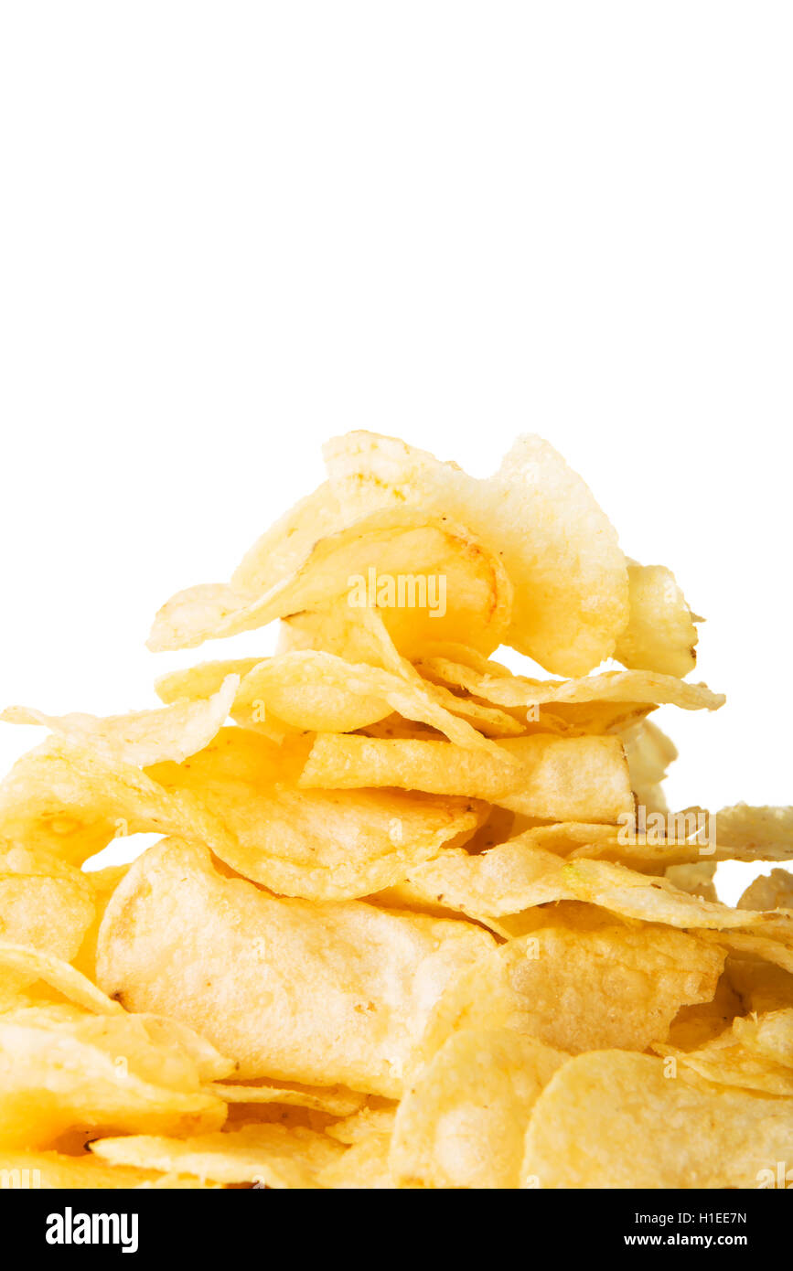 Yellow, tasty but unhealthy potatoe chips Stock Photo - Alamy