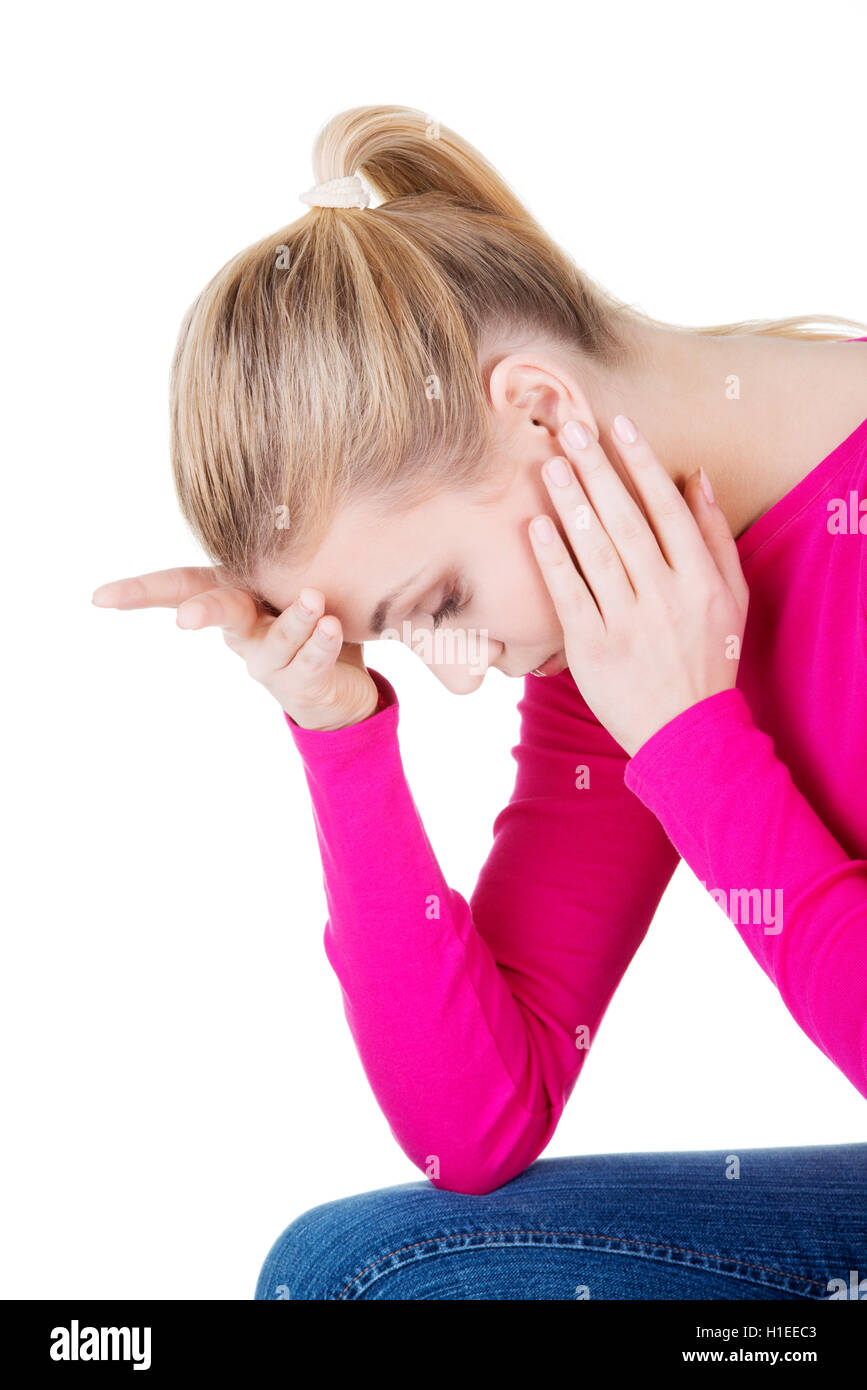 Beautiful casual woman is touching her temples Stock Photo - Alamy