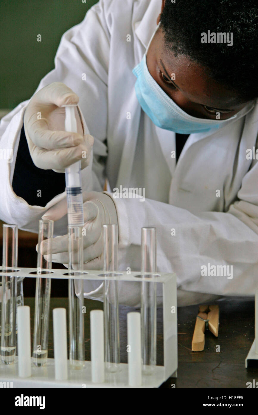 School girl doing experiment in school lab, St Mark's School, Mbabane ...