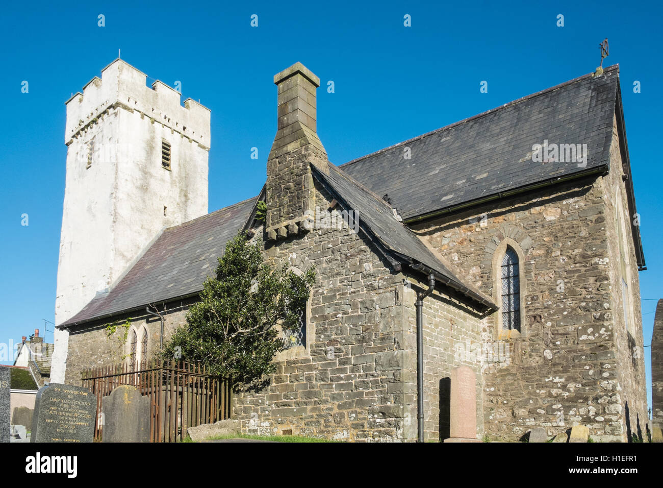 Ancient church and bell tower in centre of village of Llansaint,a ...