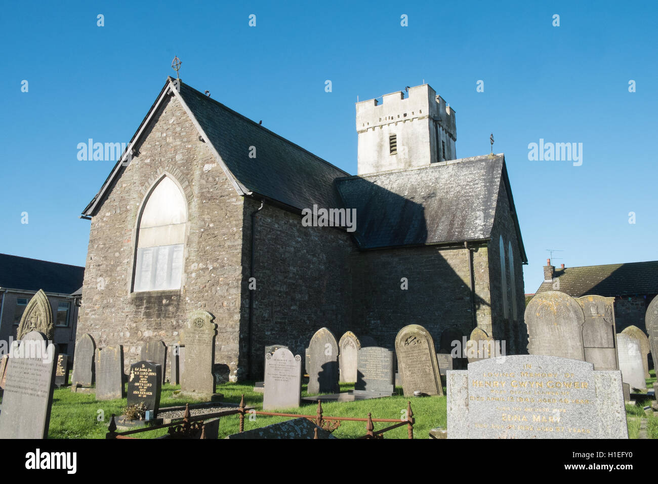 Ancient church and bell tower in centre of village of Llansaint,a ...