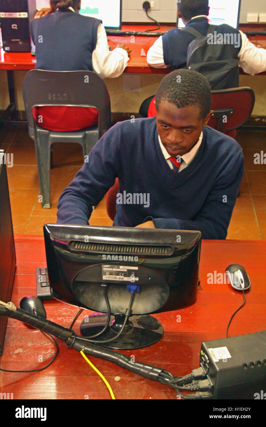 School boy working on computers in computer classroom, St Mark's School ...