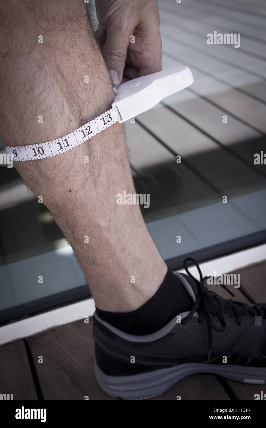 Body of a man measuring contour and body fat Stock Photo - Alamy