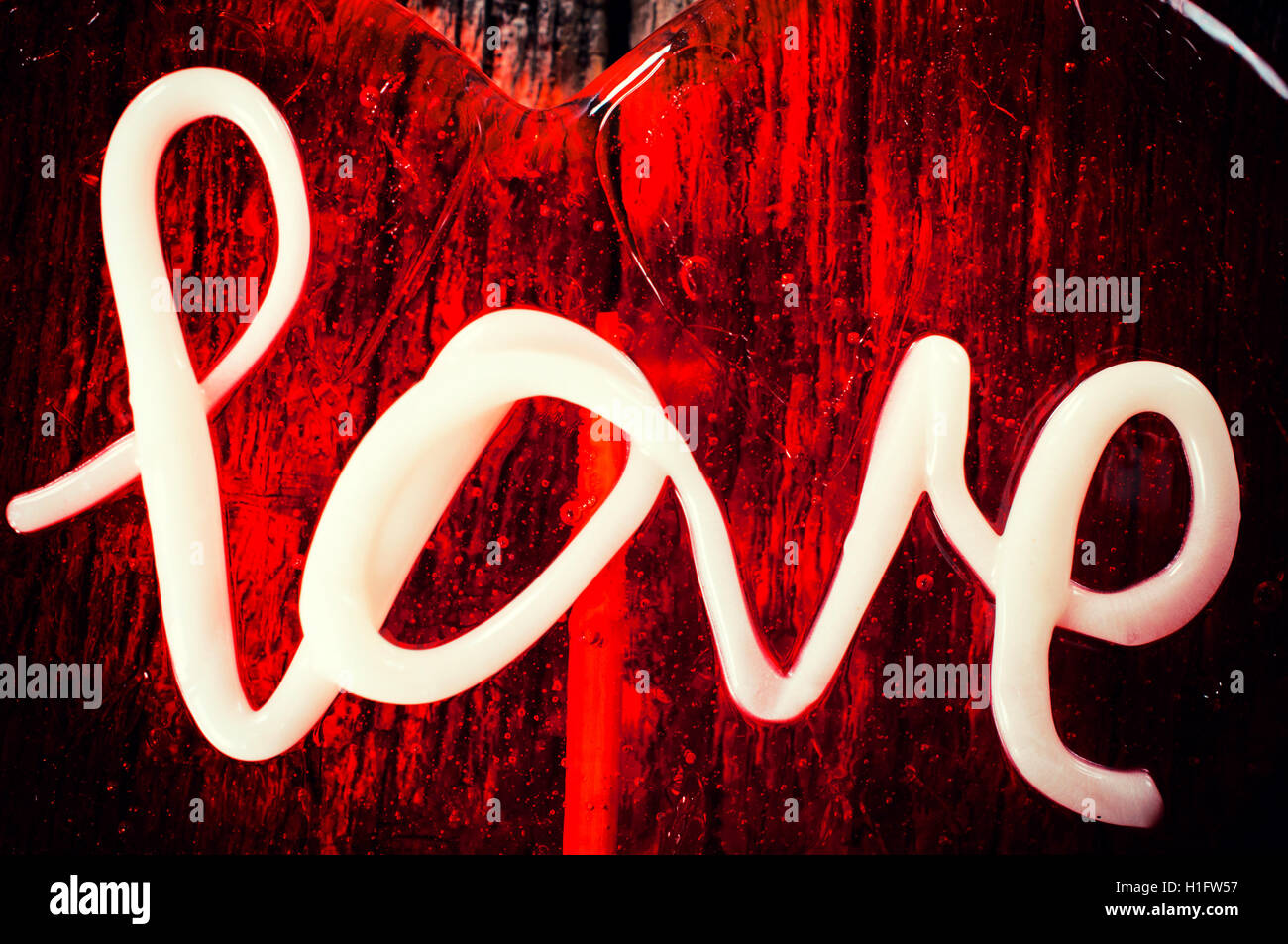 Love on red Stock Photo - Alamy