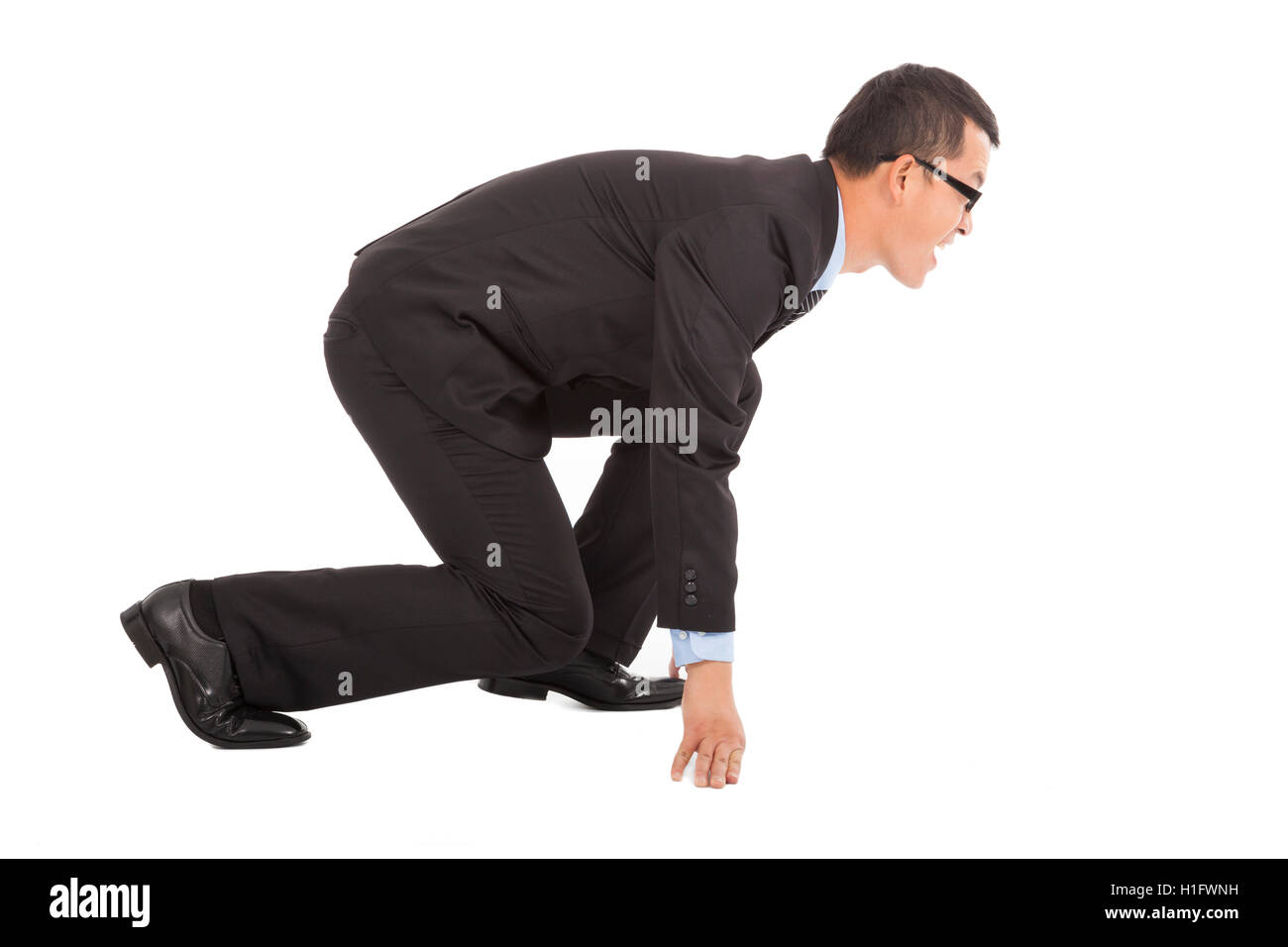 screaming businessman ready to run .isolated on white Stock Photo - Alamy