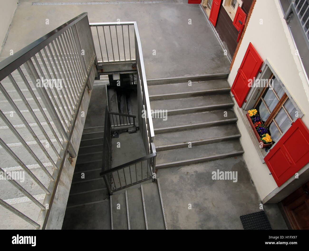 Stairs and red shutters Stock Photo - Alamy