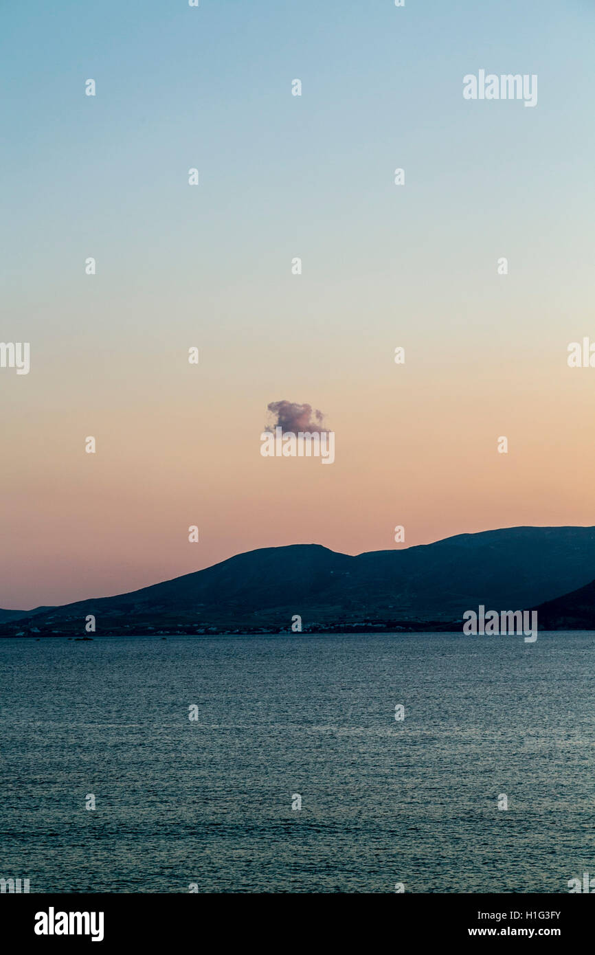 lonely cloud over an island mountain, sunset Stock Photo - Alamy
