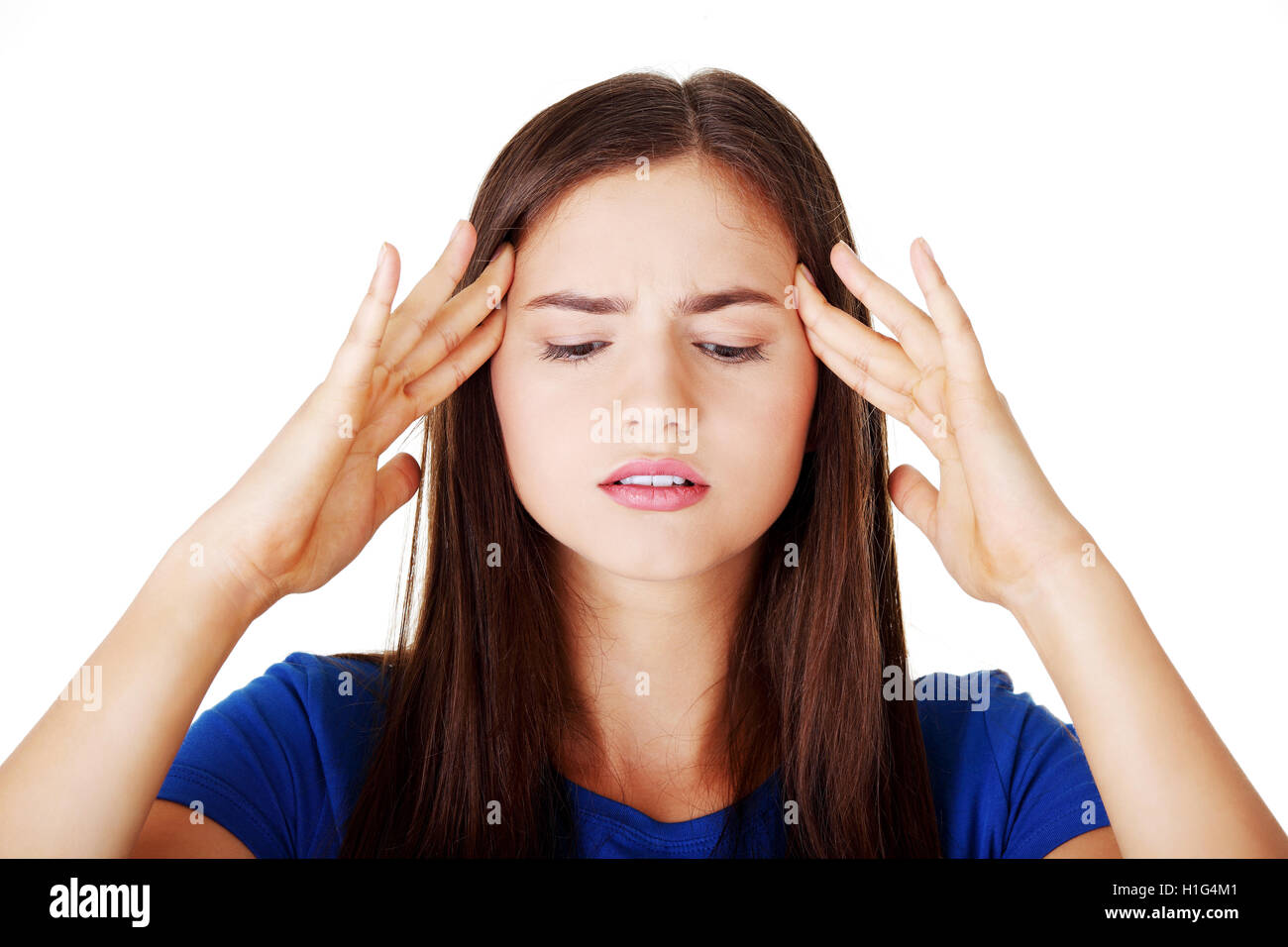 Young beautiful casual woman is touching her temples Stock Photo - Alamy