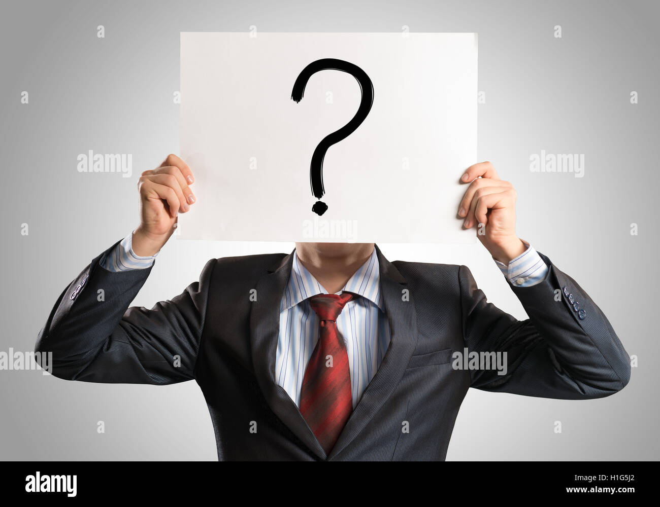 Business man hold a red question mark hi-res stock photography and ...