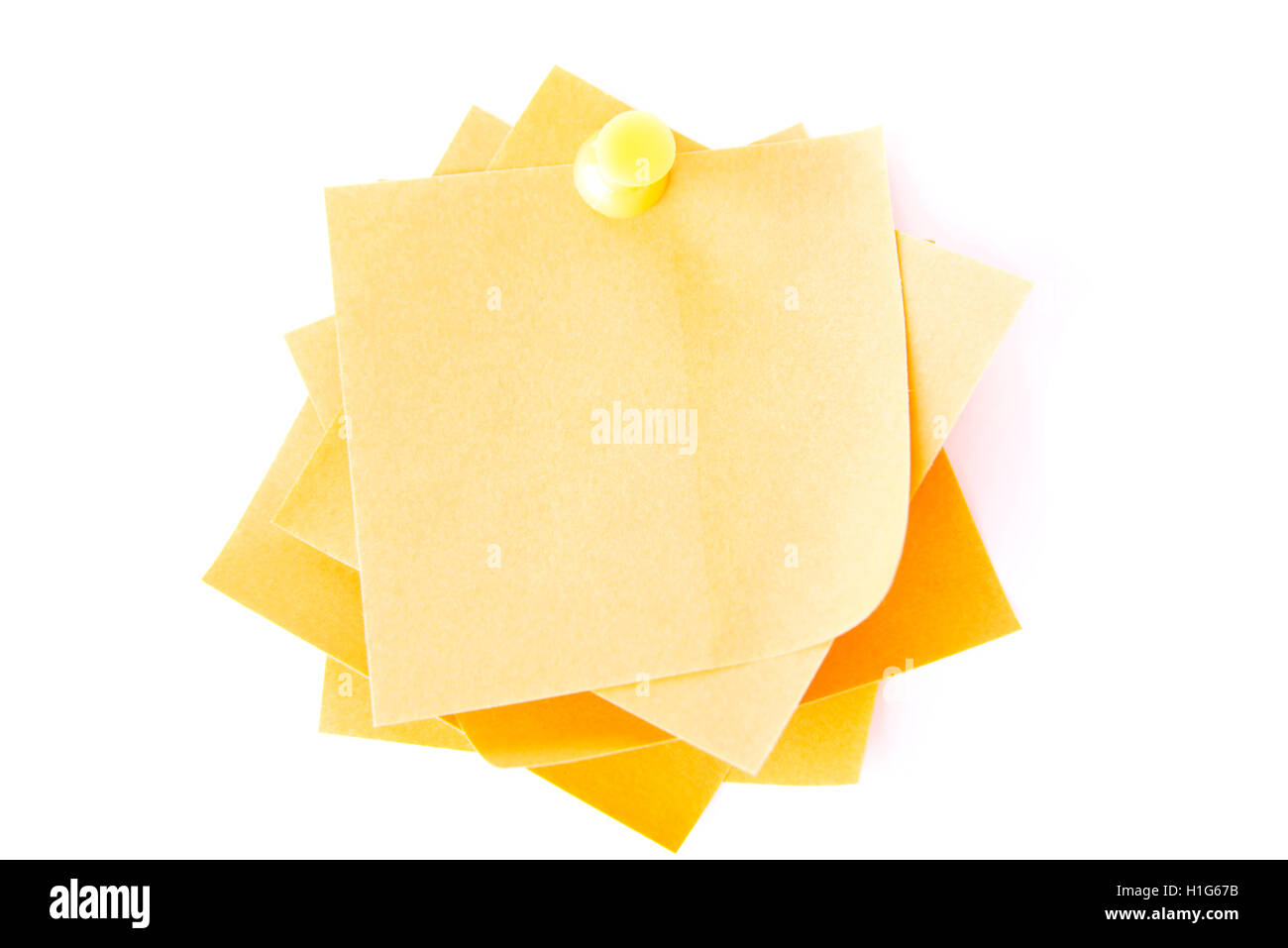 Yellow small memo attached with drawin pin Stock Photo - Alamy