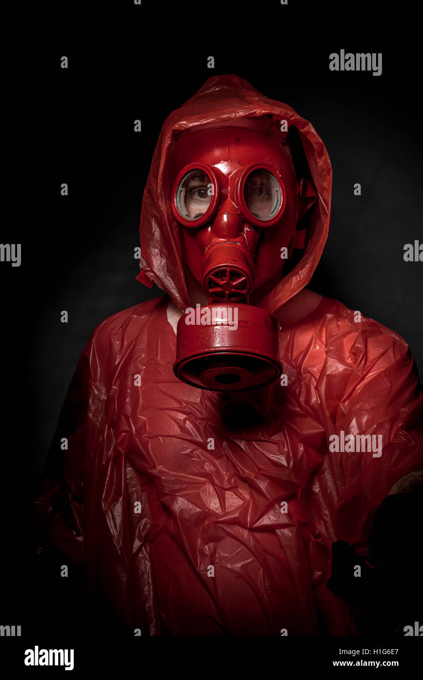 Horror, A man in a gas mask over the smoke. black background an Stock ...