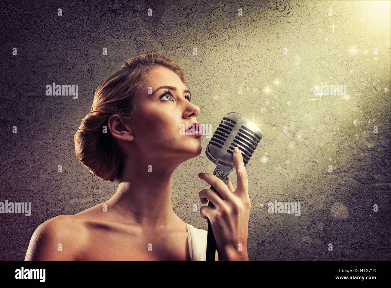 attractive female singer with microphone Stock Photo - Alamy