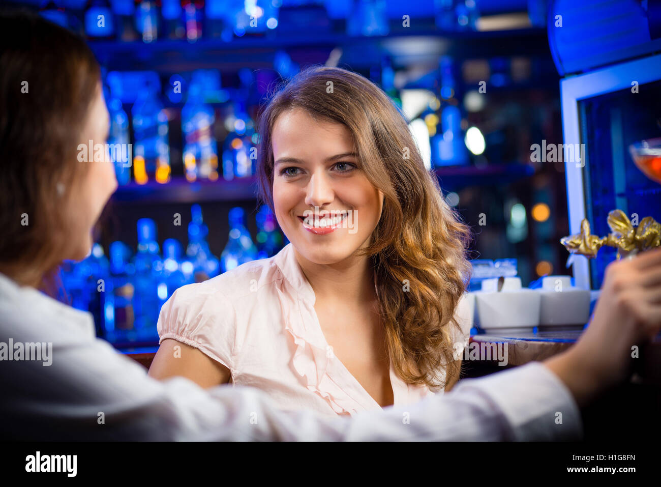 young woman in a bar Stock Photo - Alamy