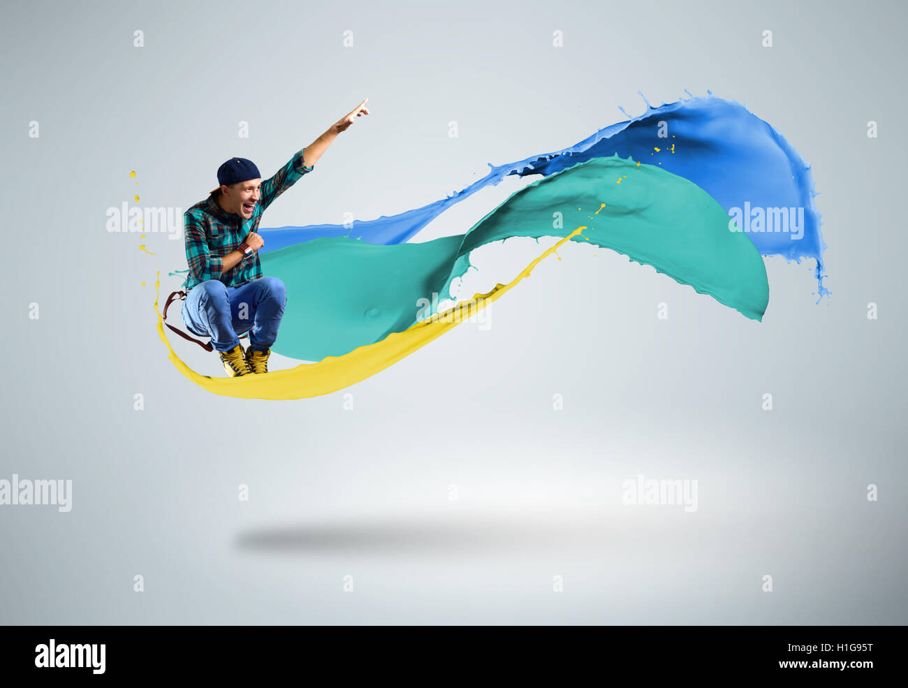 young male dancer jumping with splash of paint Stock Photo - Alamy